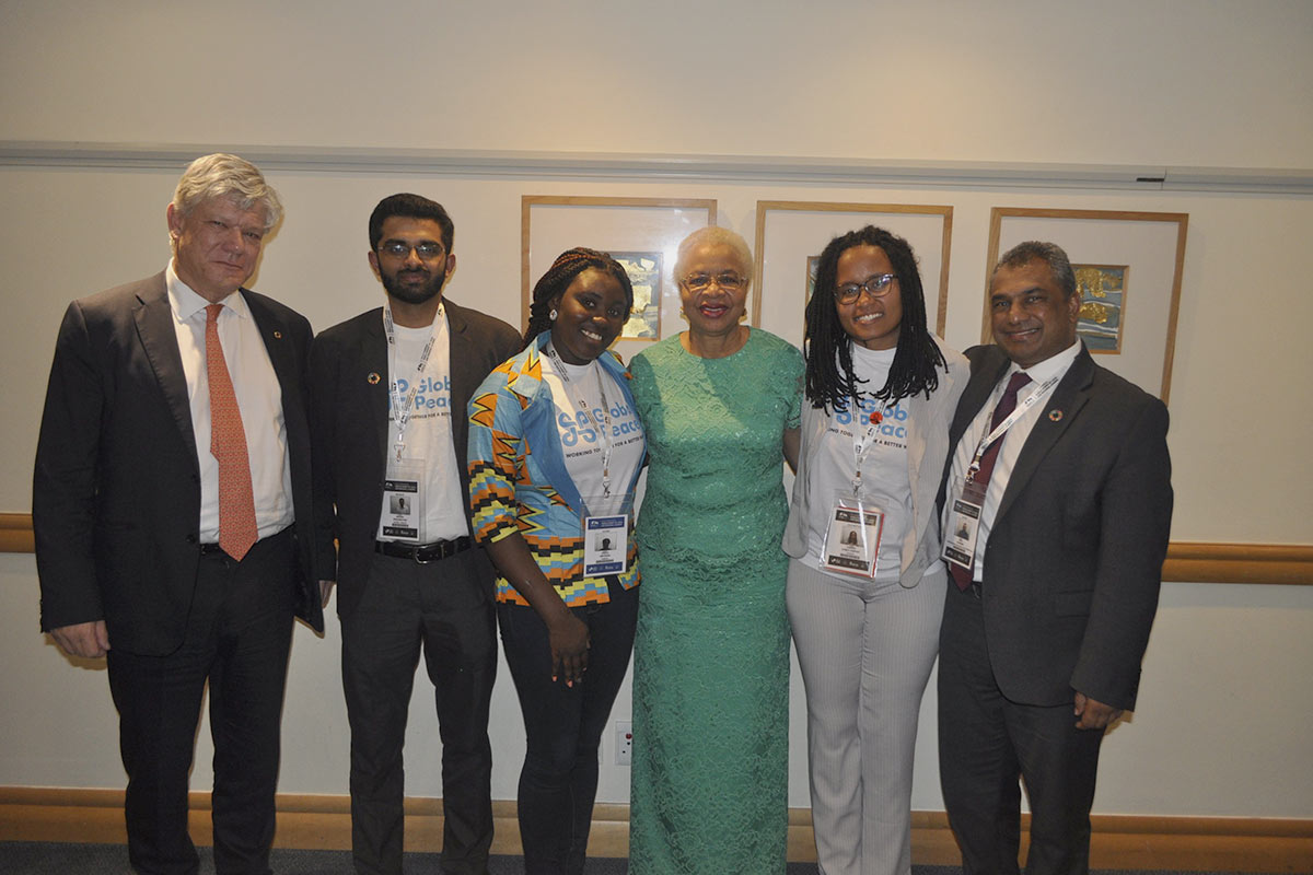Global youth representatives join Mrs Machel and Mr Hochschild in a ...